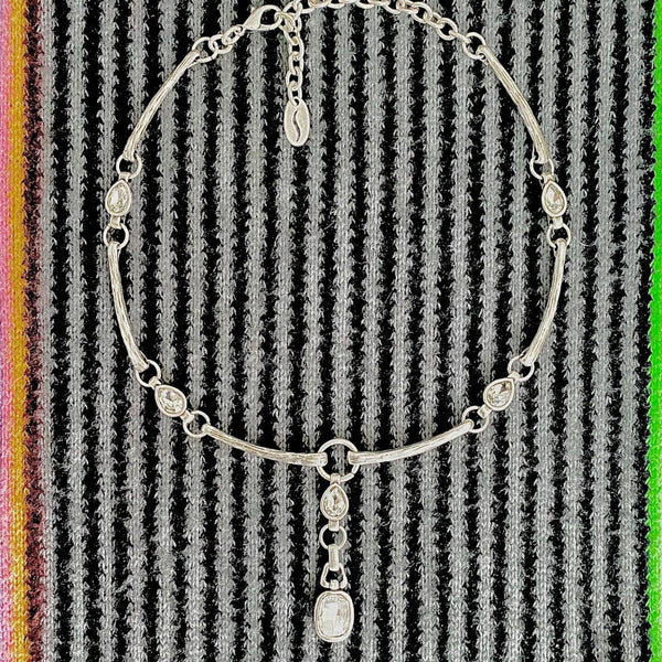 PICCOLO Necklace features a rectangular crystal beveled pendant ...